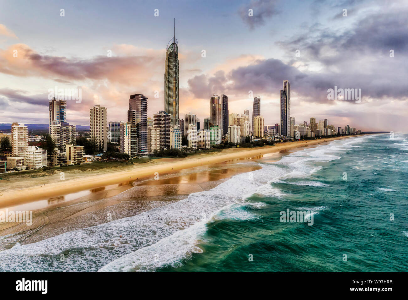 Surfers and beach goers enjoying relaxing life style in Surfers ...
