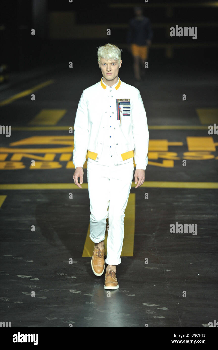 A model displays a new creation in the Cabbeen fashion show during the ...