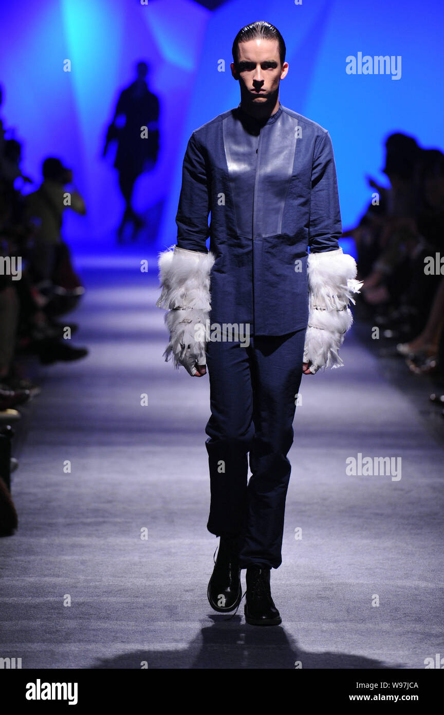 A model presents the new creation by Chinese fashion designer Simon Gao during his 2012 Autumn ...