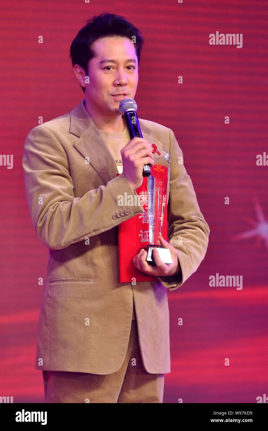 Chinese singer and actor Cai Guoqing poses the 25th World ADIS Day ...
