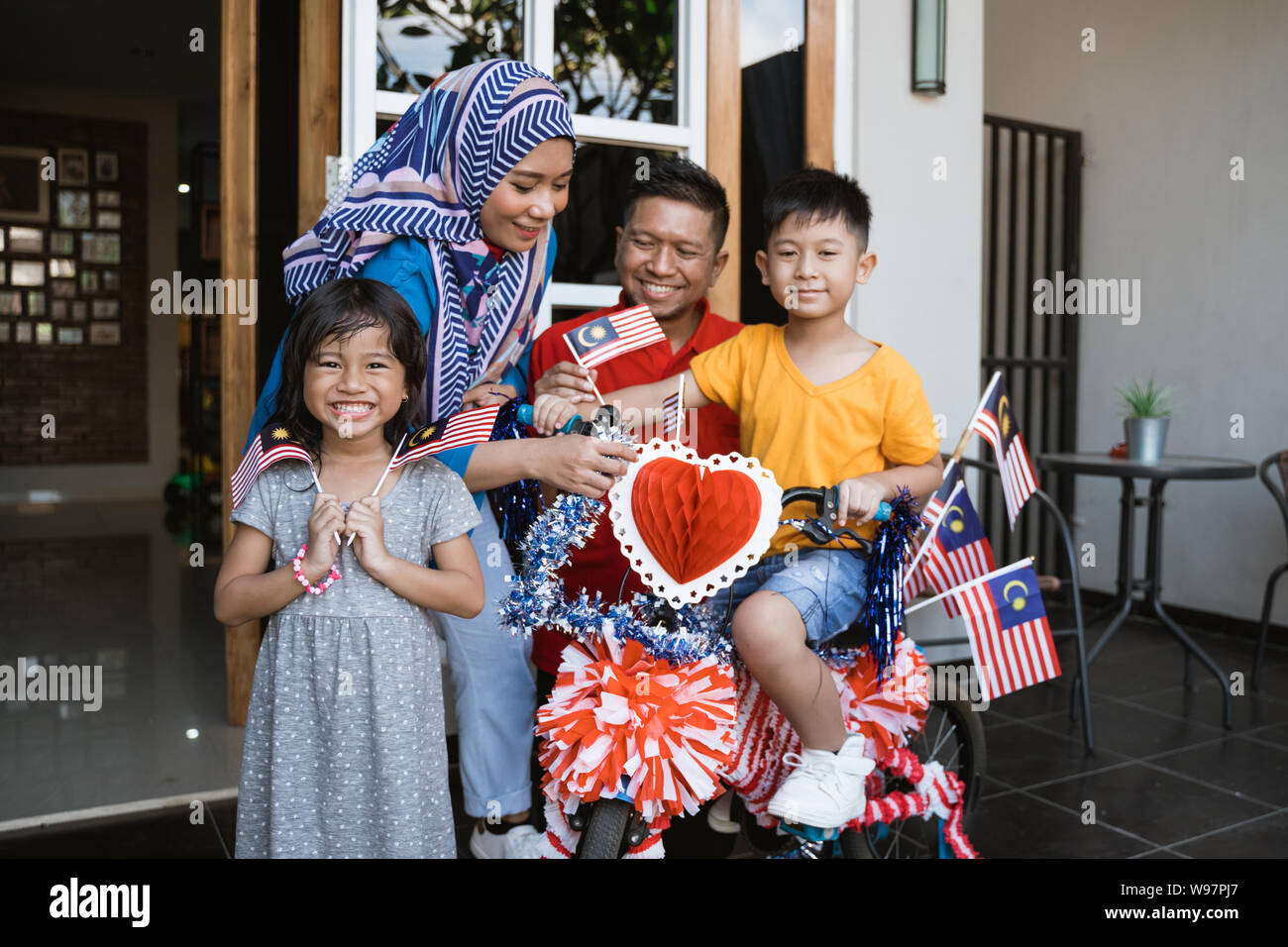 family and son celebrating malaysia merdeka or malaysian independence ...