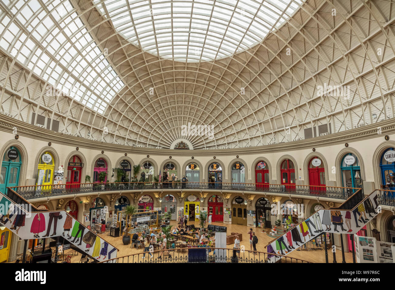 Inside Leeds Corn Exchange building with lots of shops and boutiques ...