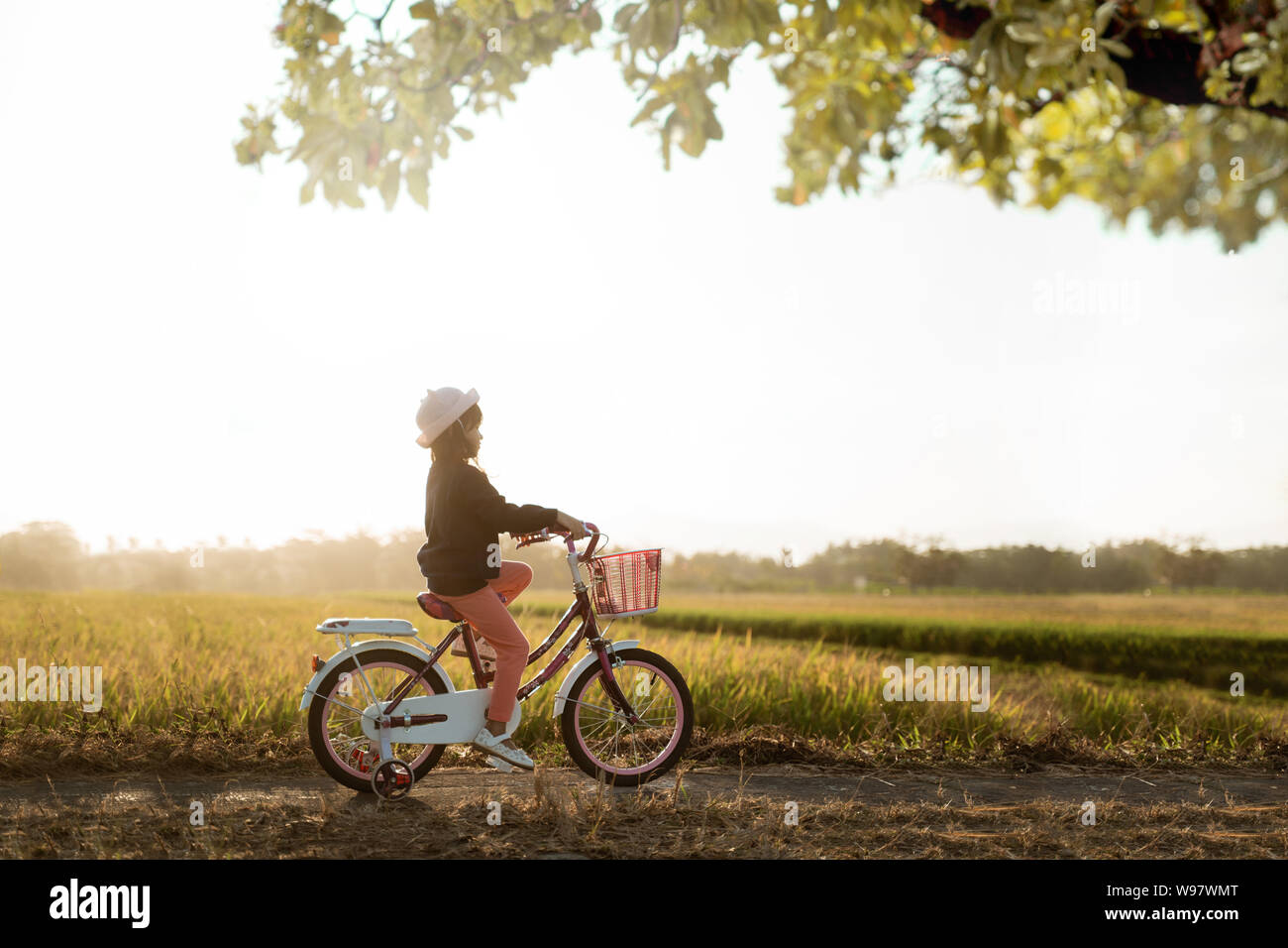 independent asian child ride her bicycle Stock Photo - Alamy