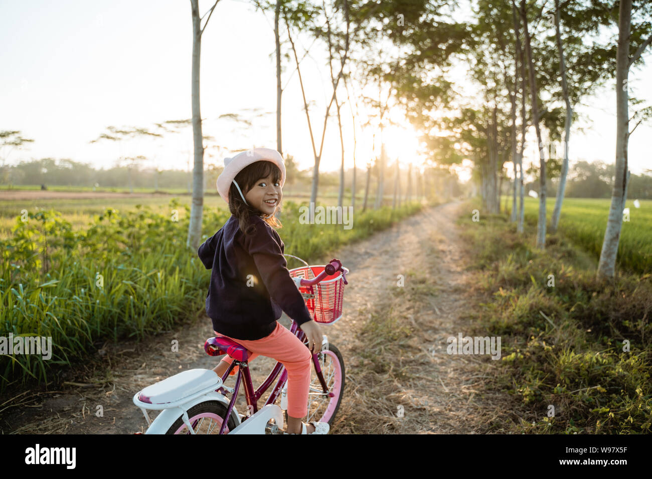 independent asian child ride her bicycle Stock Photo - Alamy