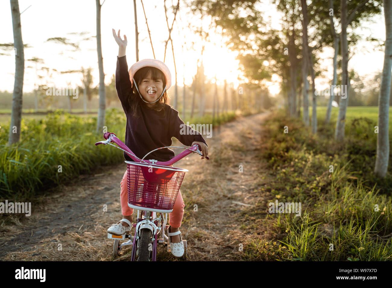 independent asian child ride her bicycle Stock Photo - Alamy
