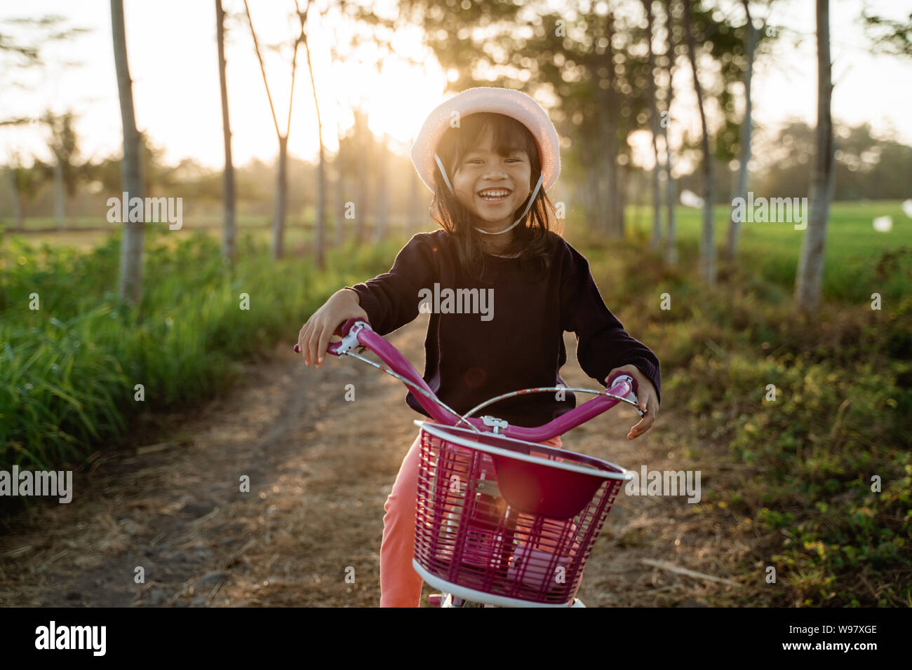 independent asian child ride her bicycle Stock Photo - Alamy