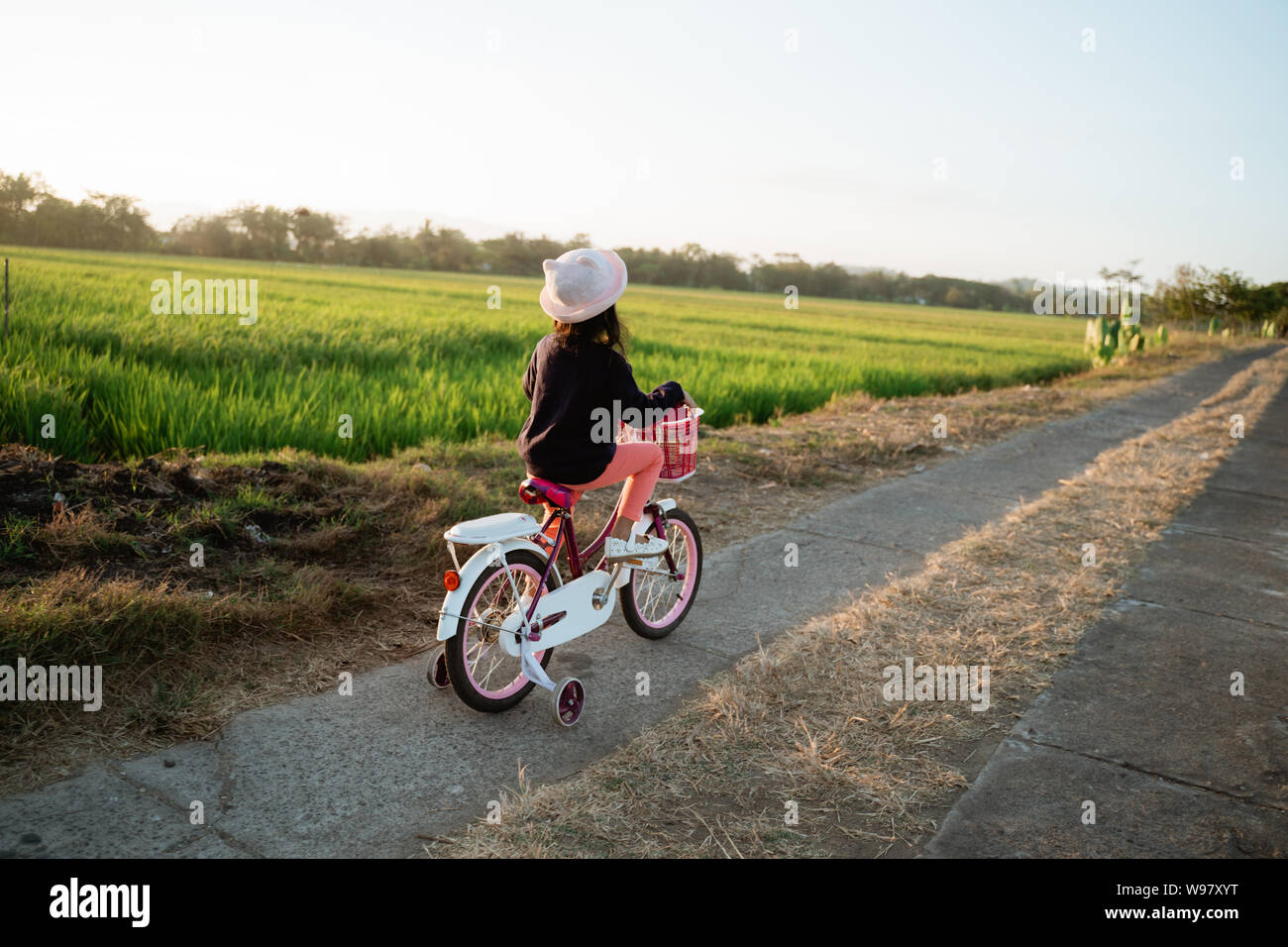 independent asian child ride her bicycle Stock Photo - Alamy