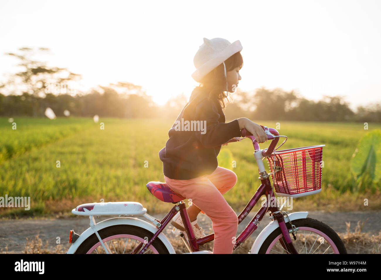 independent asian child ride her bicycle Stock Photo - Alamy