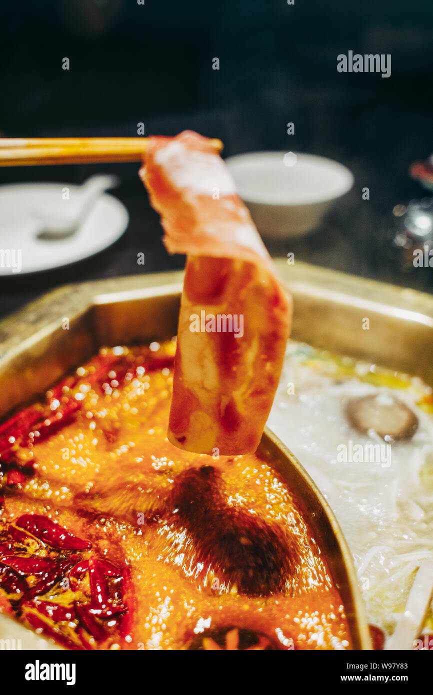 Chinese hot pot, with mala spicy soup Stock Photo - Alamy