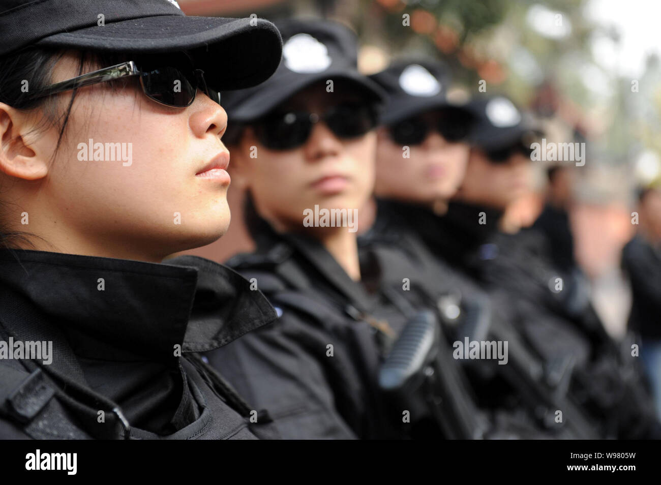 Chinese special policewomen patrol a street in Chengdu city, southwest ...