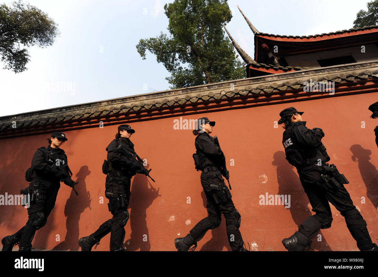 Chinese special policewomen patrol a street in Chengdu city, southwest ...