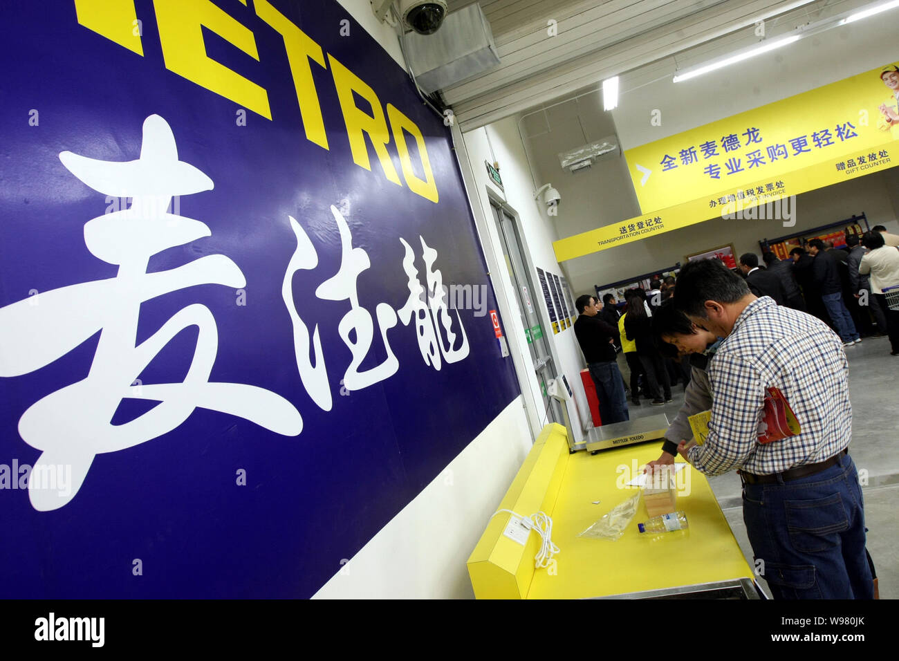Chinese customers are pictured at the first Metro store in Foshan city ...