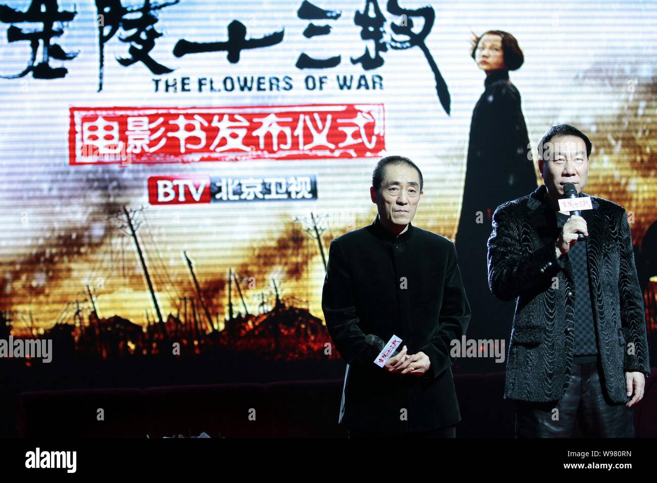 Chinese producer Zhang Weiping, right, speaks next to film director ...