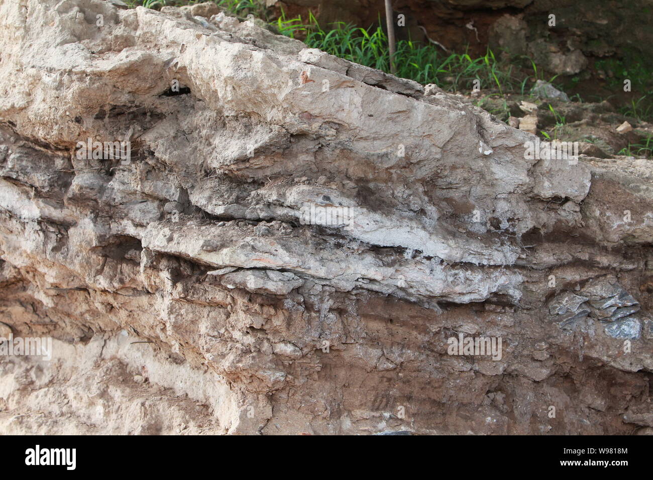 Ash layers are seen at Zhoukoudian in a suburb of Beijing, capital of ...