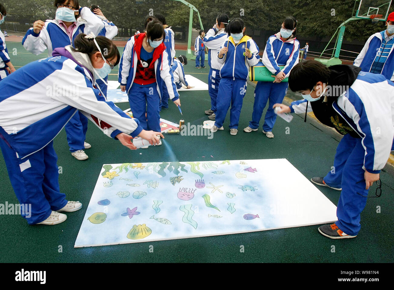 Chinese studens make paintings in the house building competition of a ...