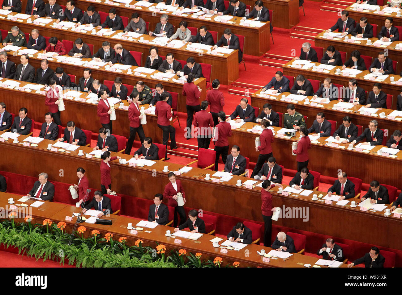 Chinese top leaders and other deputies attend the opening ceremony of ...