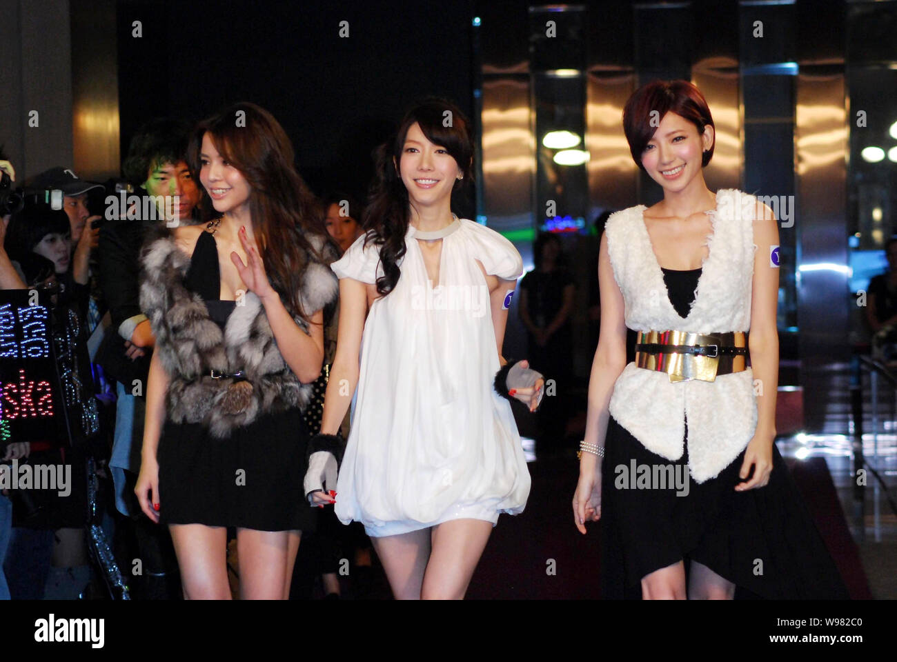 Members of Taiwanese girl group Dream Girls arrive for the 2011 Yahoo Asia Buzz Awards ceremony ...
