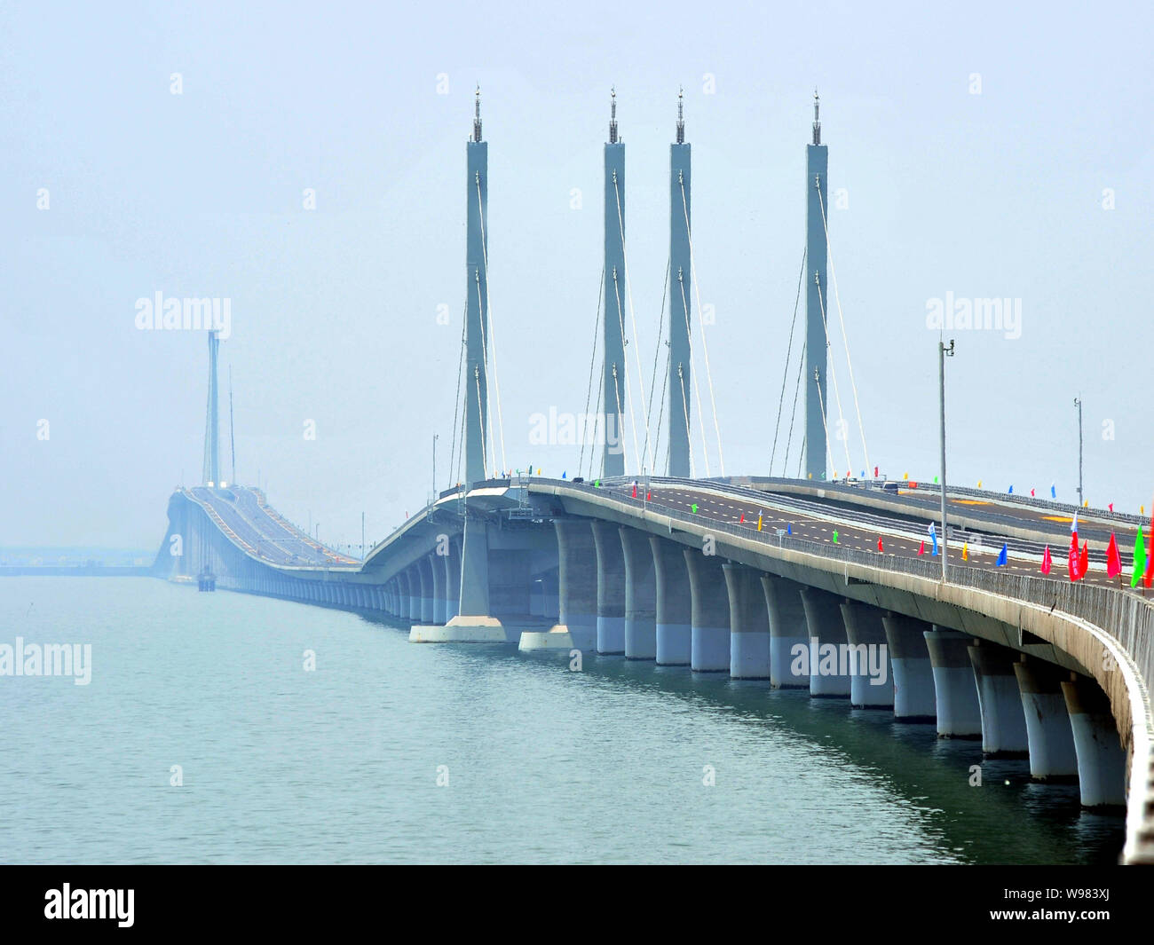 Vehicles travel on the Jiaozhou Bay Bridge, also called the Qingdao ...