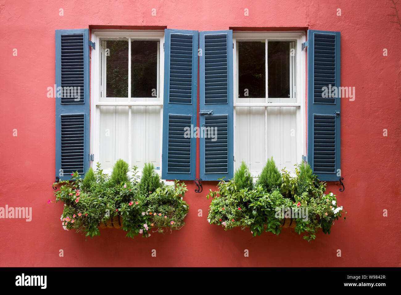 Scenic summer detail of window boxes filled with summer greenery ...