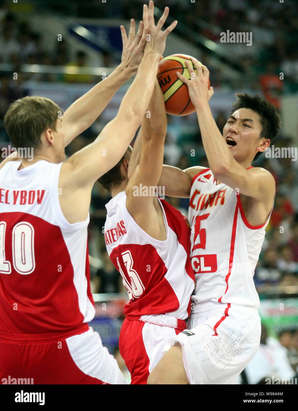Chinas Zhang Bo tries to shoot against Russia during their FIBA ...