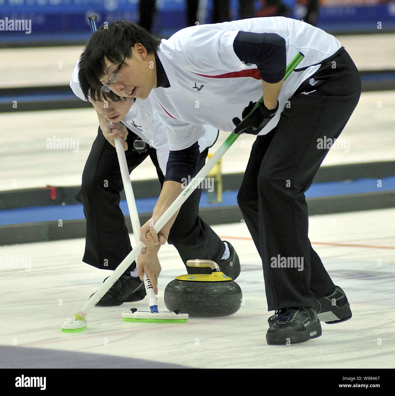 Players of Japan compete in a mens double round-robin match against ...