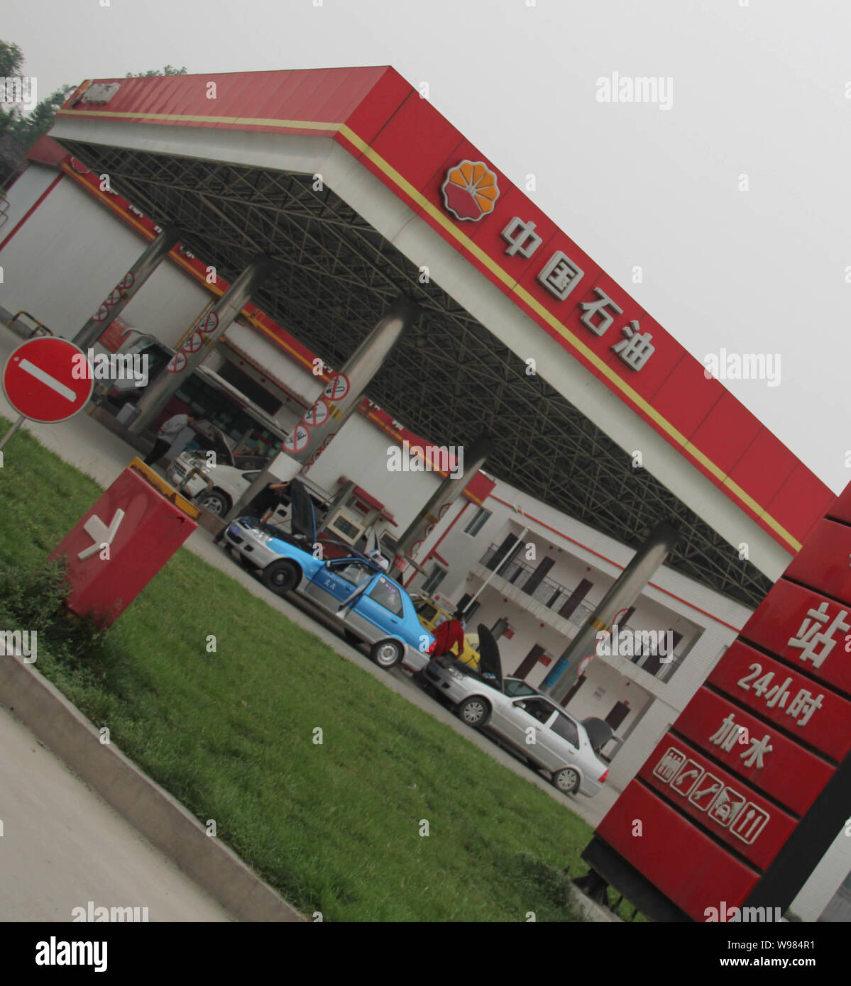 --File--Cars get refueled at a petrol station of PetroChina in Chengdu ...