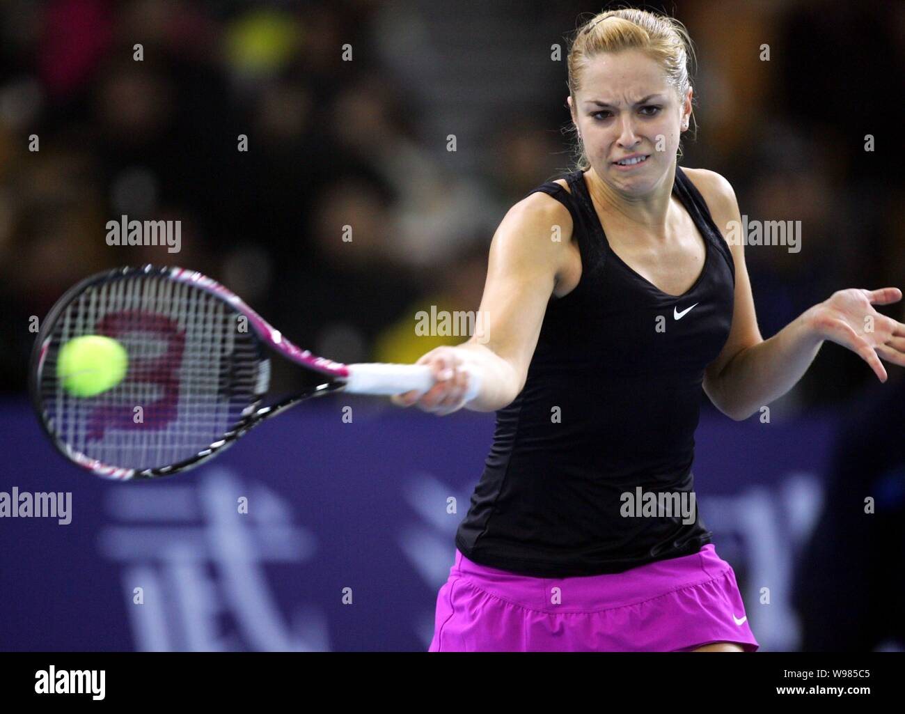 Sabine Lisicki of Germany returns a shot during 2011 Li Na & Friends ...