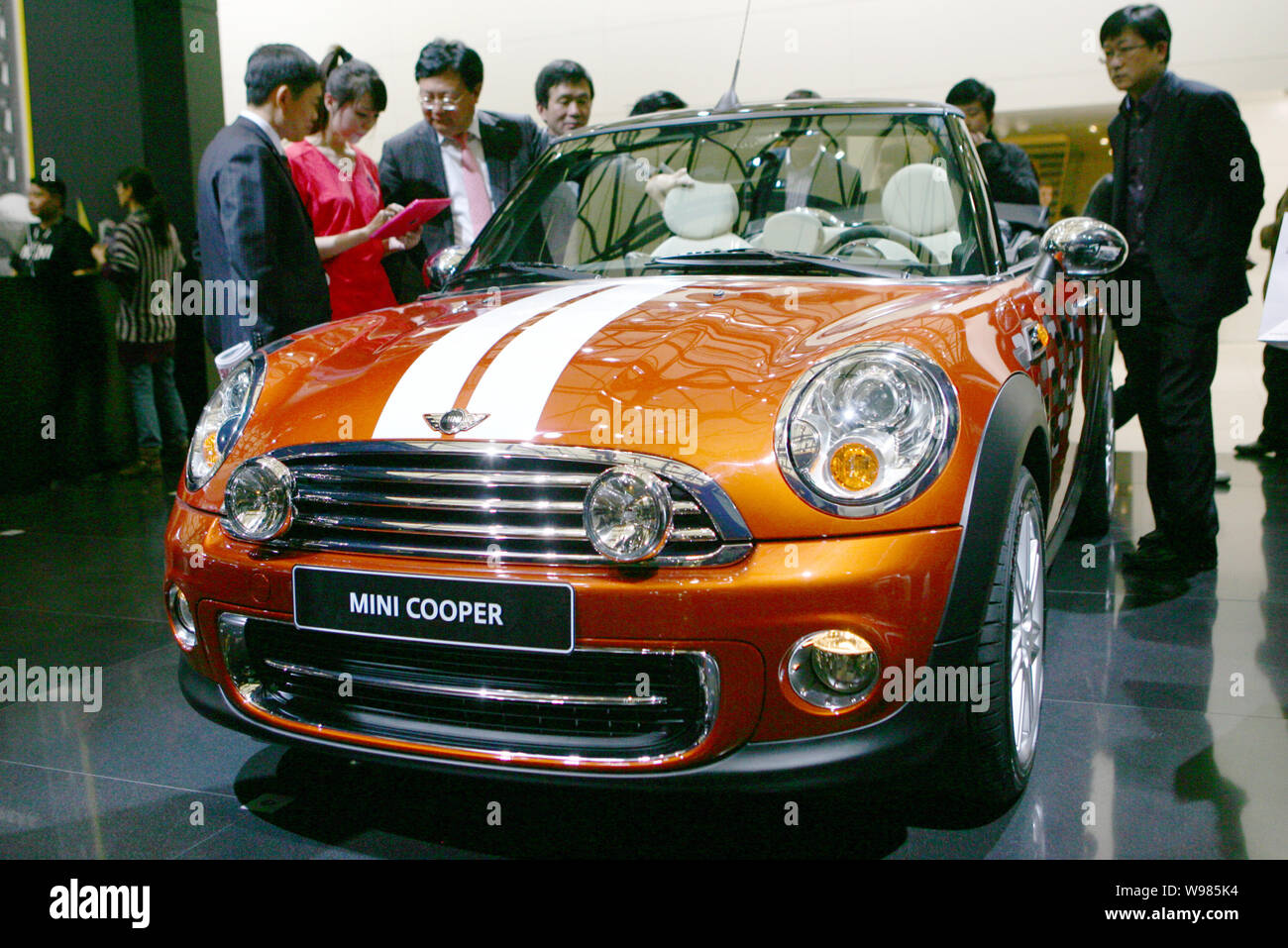 --FILE--Visitors look at a Mini Cooper at the 14th Shanghai ...