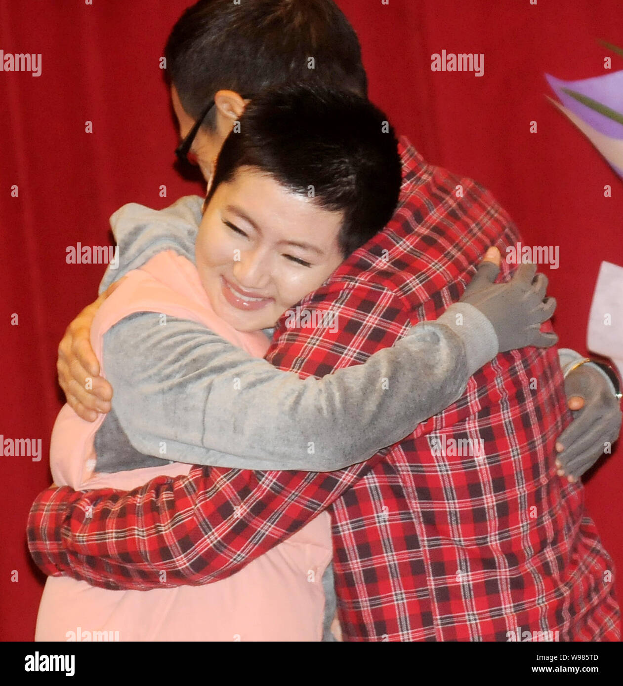 Selina Jen (or Selina Ren) of Taiwanese girl pop group S.H.E hugs her ...
