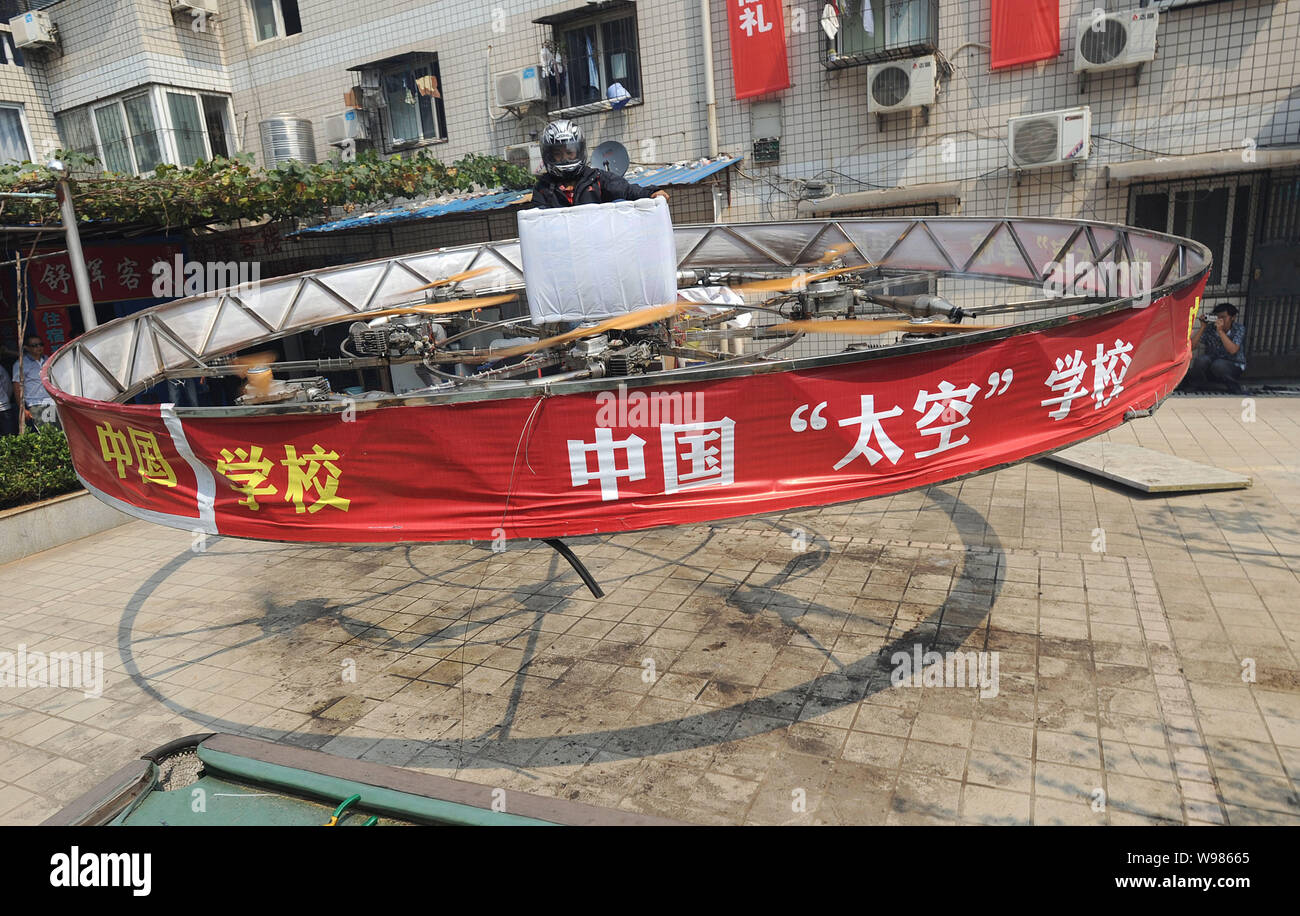 Chinese farmer Shu Mansheng flys his self-designed and homemade flying ...