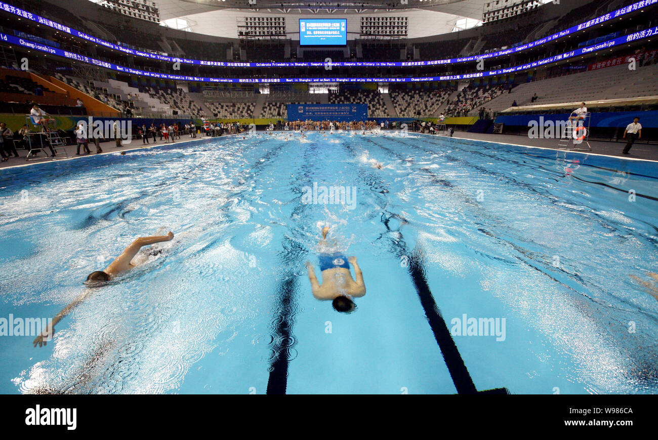 Local swimmers swim in the main pool at the Shanghai Oriental Sports ...