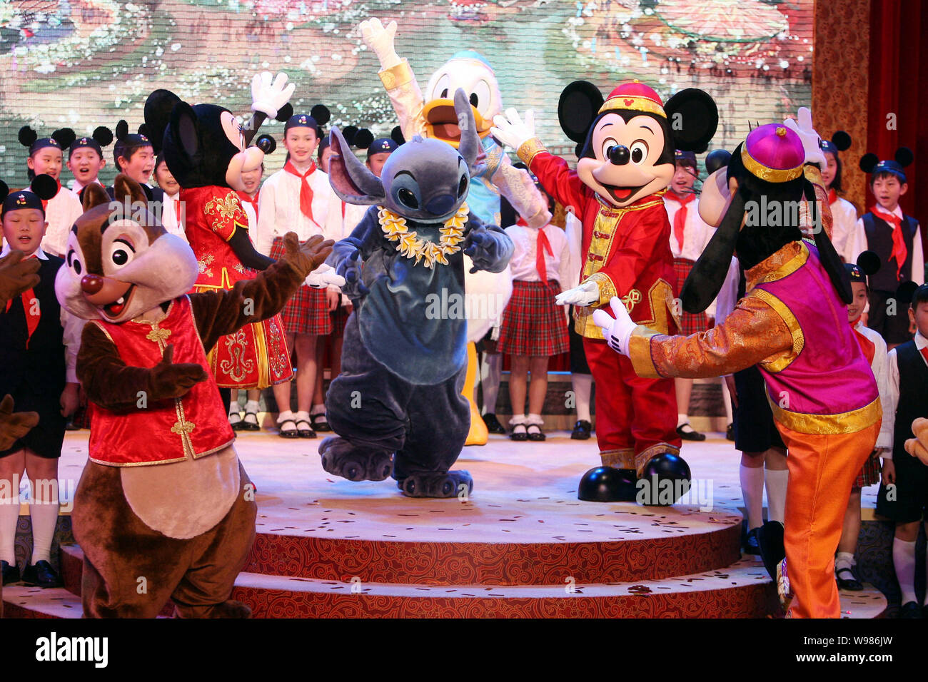Walt Disney cartoon characters perform at the groundbreaking ceremony ...