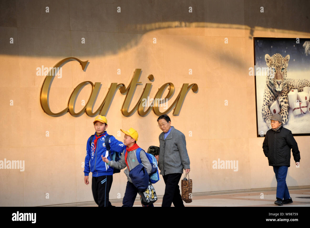 --FILE--Pedestrians walk past a Cartier store in Beijing, China, 18 ...