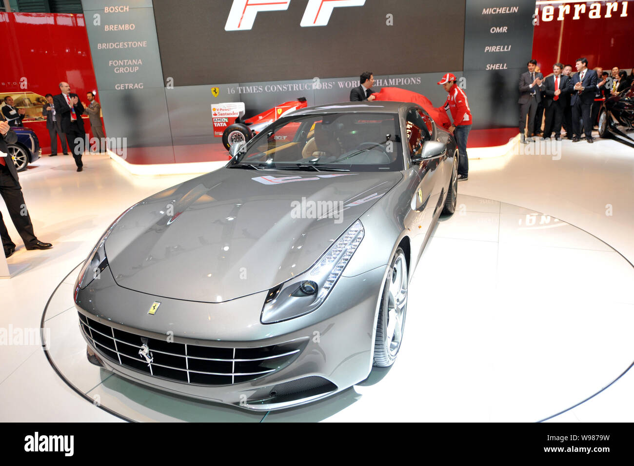 Brazilian F1 driver Felipe Massa of Ferrari, right, unveils the Ferrari ...