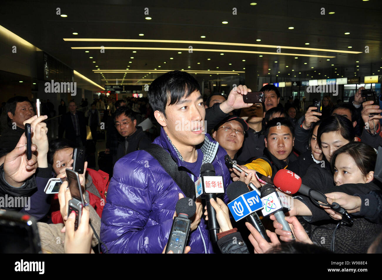 Chinese star hurdler Liu Xiang is interviewed after arriving at the ...