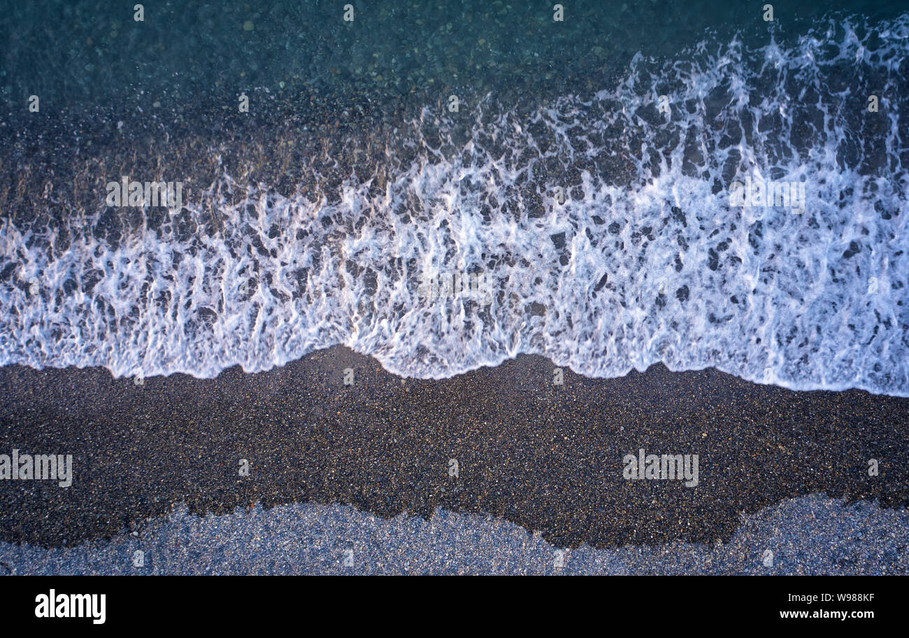 Aerial image of pebble beach natural background. Camera looks straight ...