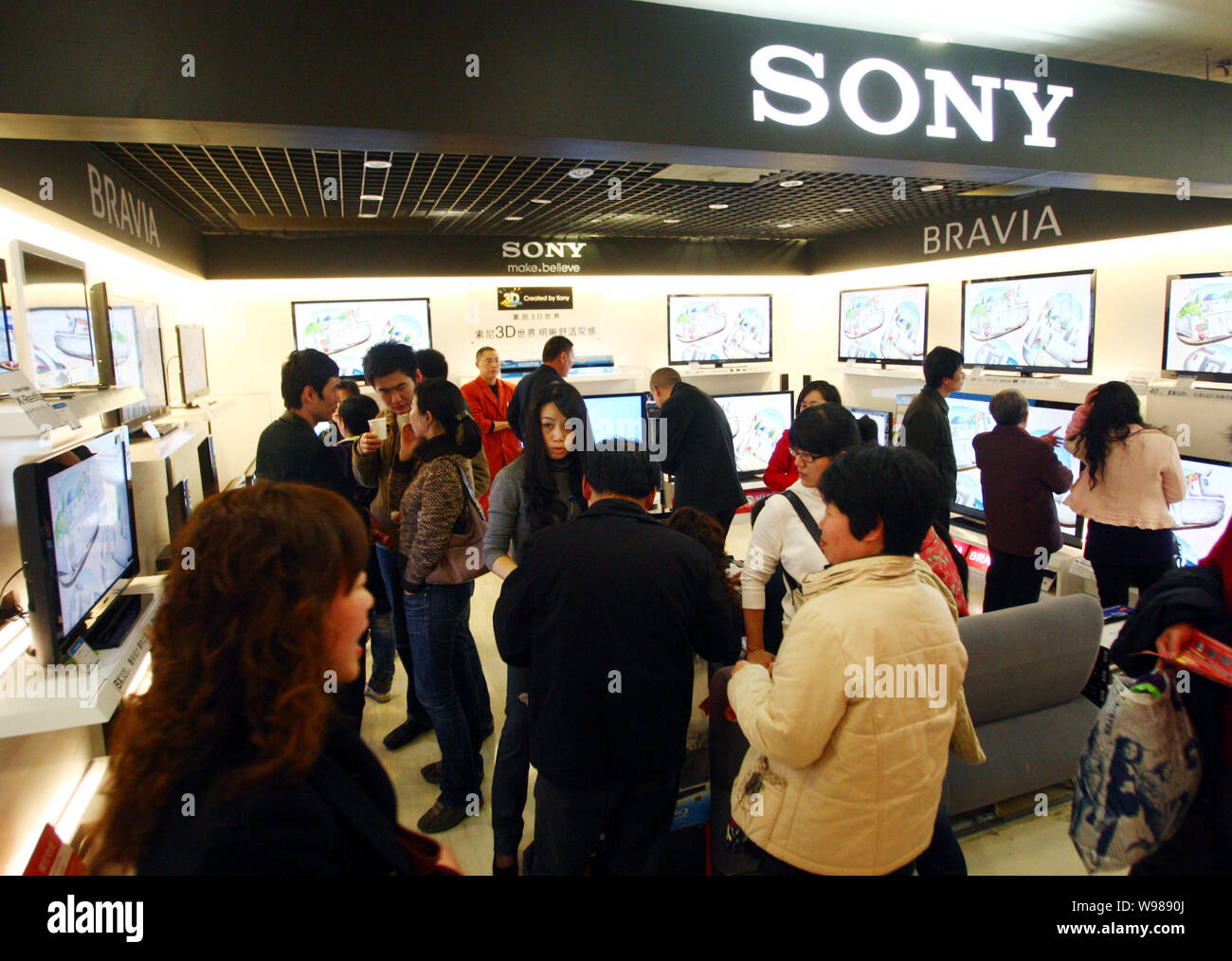 --FILE--Customers shop for Sony LCD televisions at a mall in Chongqing ...