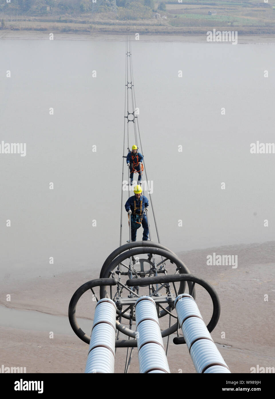 Chinese electricians check and repair UHV (ultra high voltage) electric ...