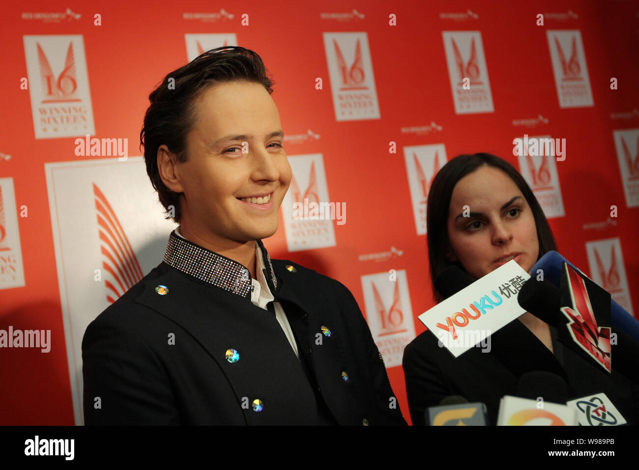 Russian pop singer Vitas (L) smiles during an interview in Wenzhou ...