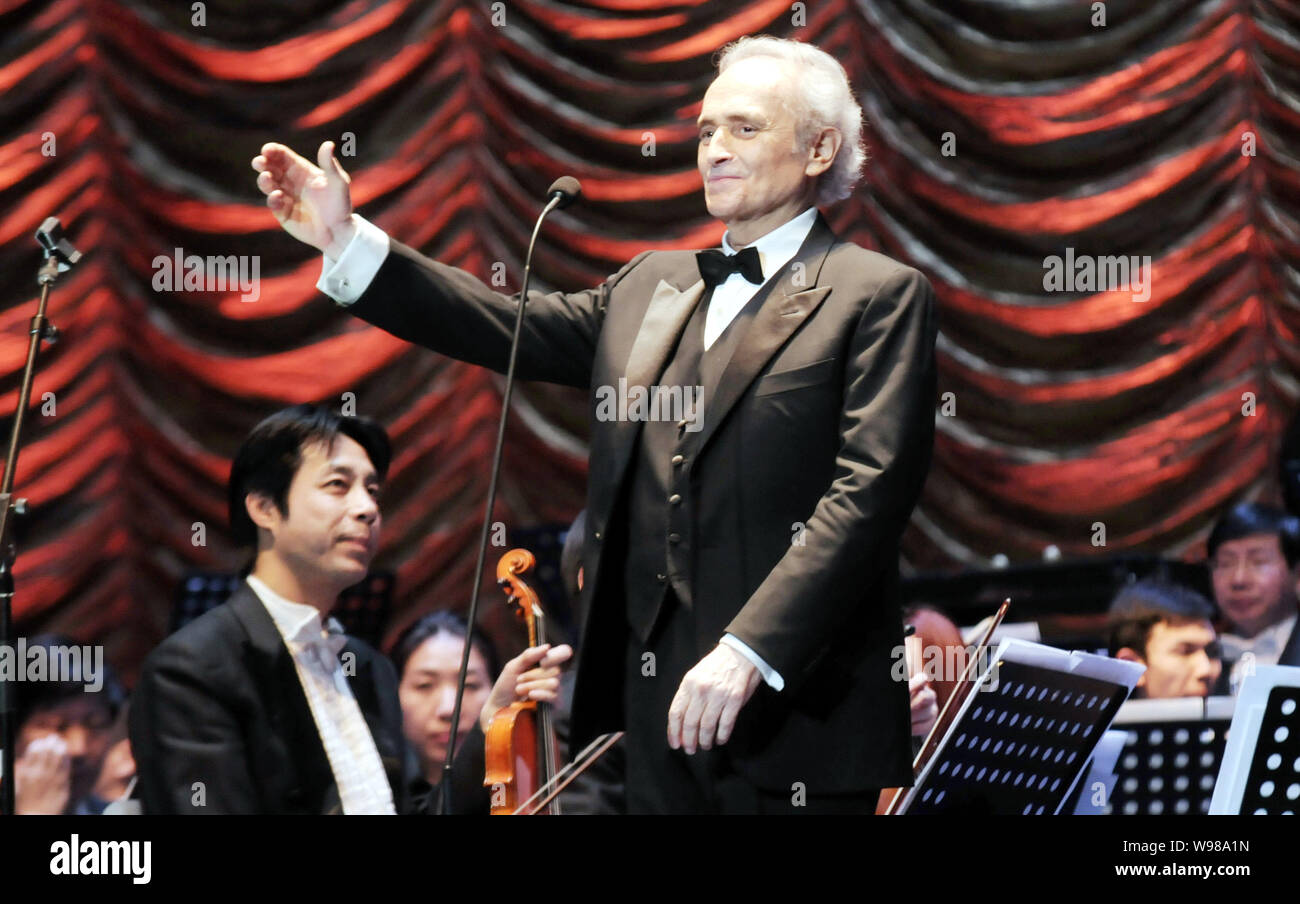 Spanish tenor Jose Carreras greets the audience at his concert in the ...