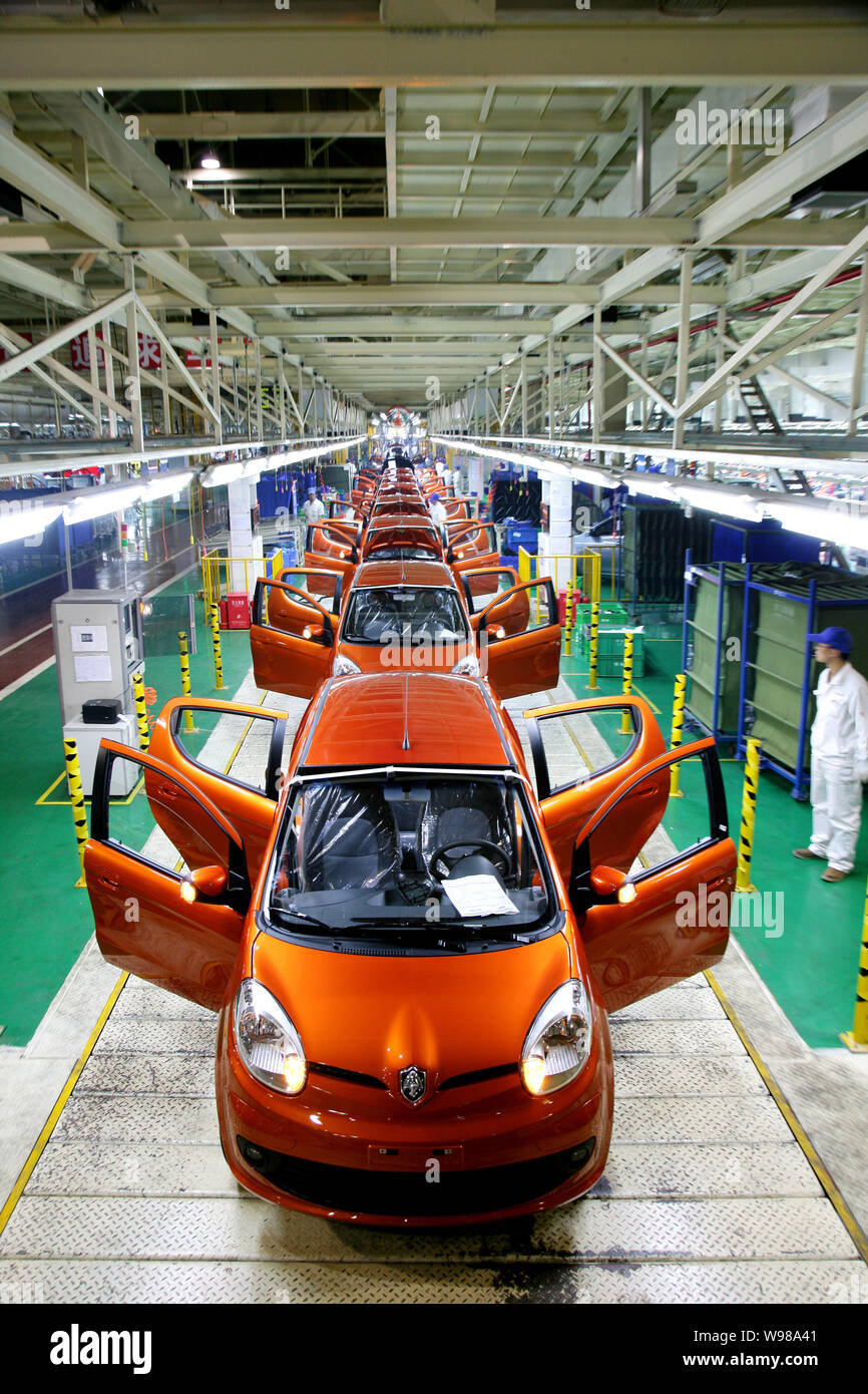 --FILE--Chana cars pass through the assembly line at the auto plant of ...
