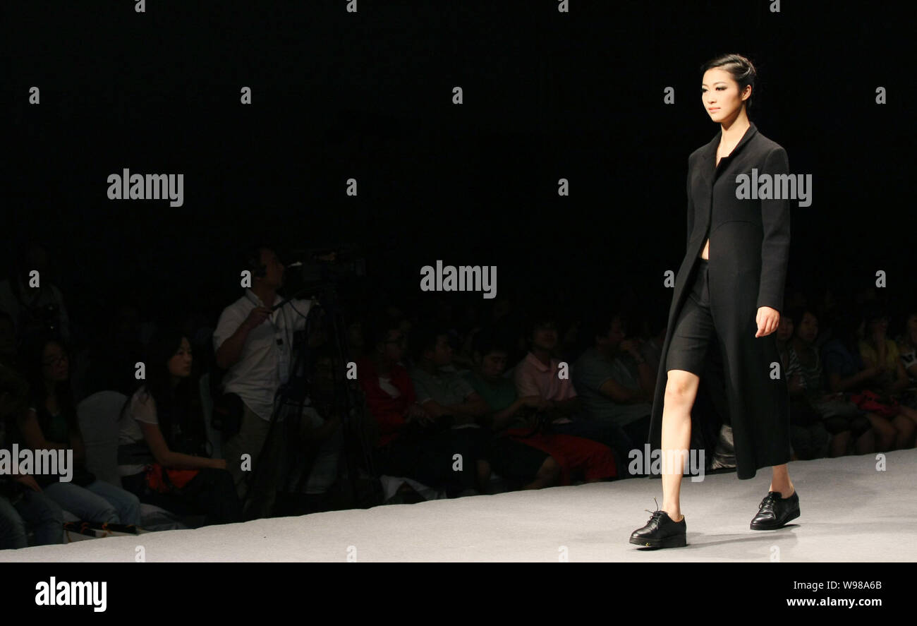 A model parades to show the new creation in the Taipei IN Style fashion ...