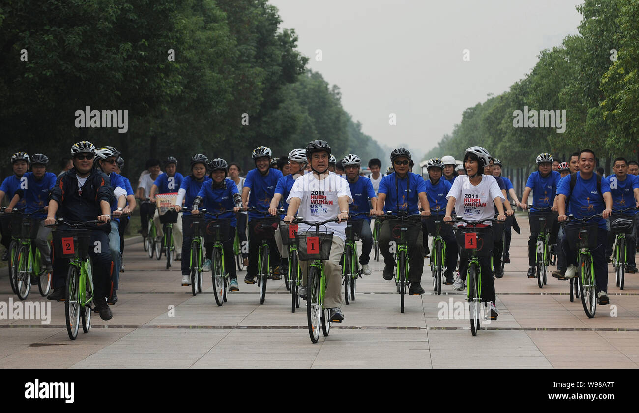 U.S. ambassador to China Gary Locke (bike No. 1), his wife, Mona Lee ...
