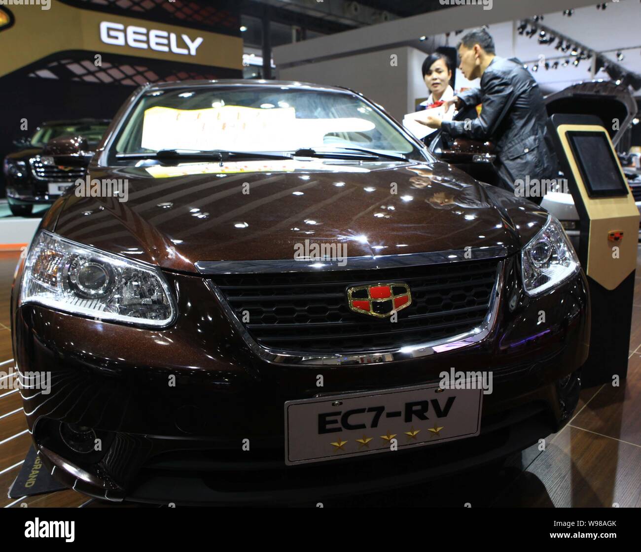 --File--Visitors are seen at the stand of Geely during an auto show in ...