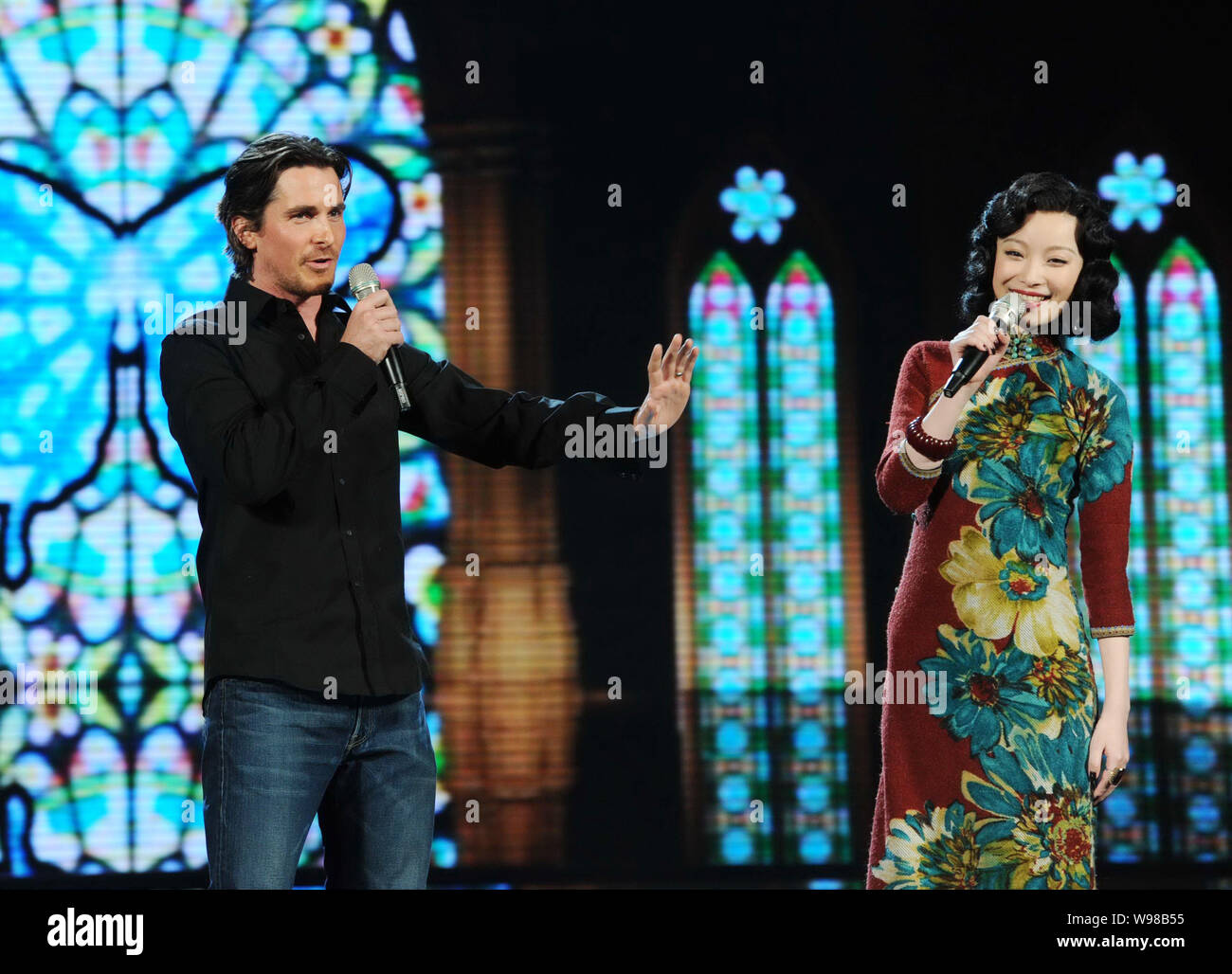 English actor Christian Bale, left, speaks next to Chinese actress Ni ...