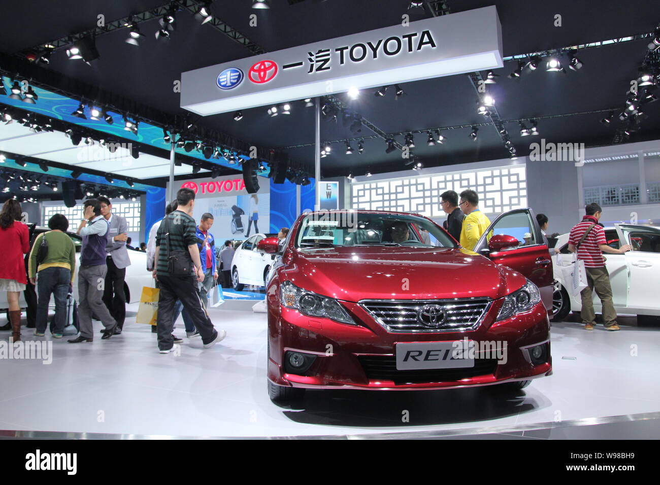 --File--Visitors are seen at the stand of Toyota during an auto show in ...