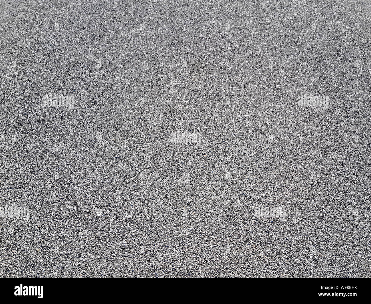 Light gray asphalt for pavement. The surface of the asphalt is smooth ...
