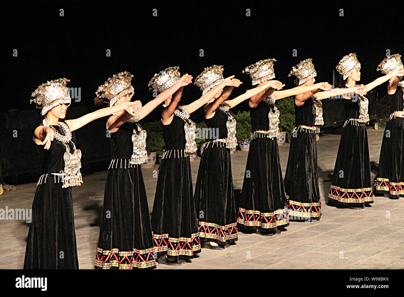 Actress in traditional costume of Zhuang ethnic minority dance during a ...