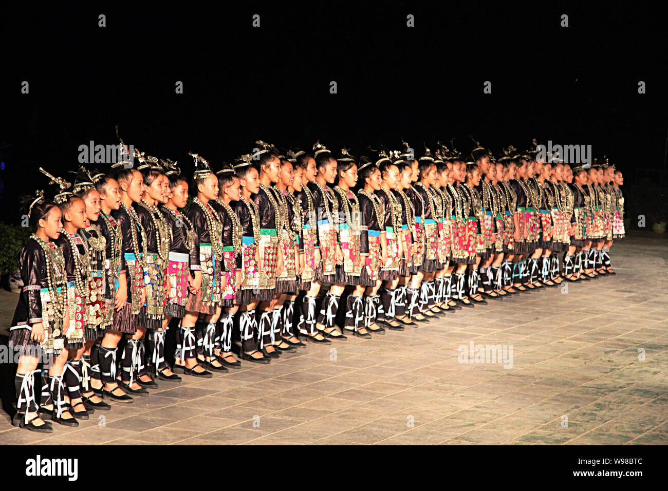 Actress in traditional costume of Zhuang ethnic minority sing during a ...