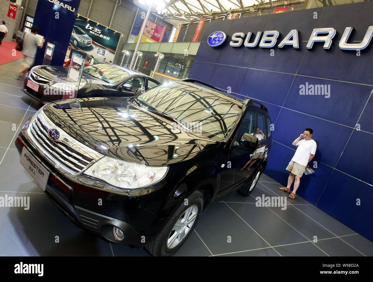 --FILE--Visitors look at Subaru cars during an auto show in Shanghai ...